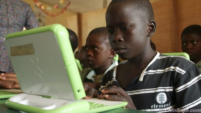Nigerian pupils work on computers at the LEA primary school in Abuja ...